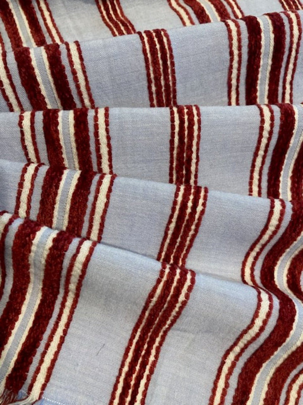 Red Raised Stripe on Sky Blue. Soft Handle, Stripes run across t